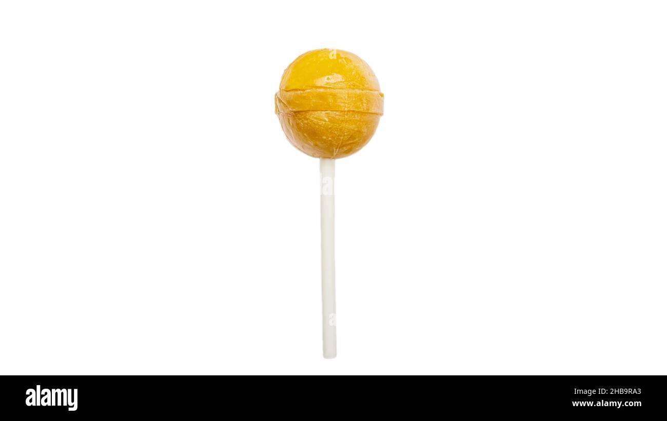 Yellow candy cane on a stick isolated on white background Stock Photo ...