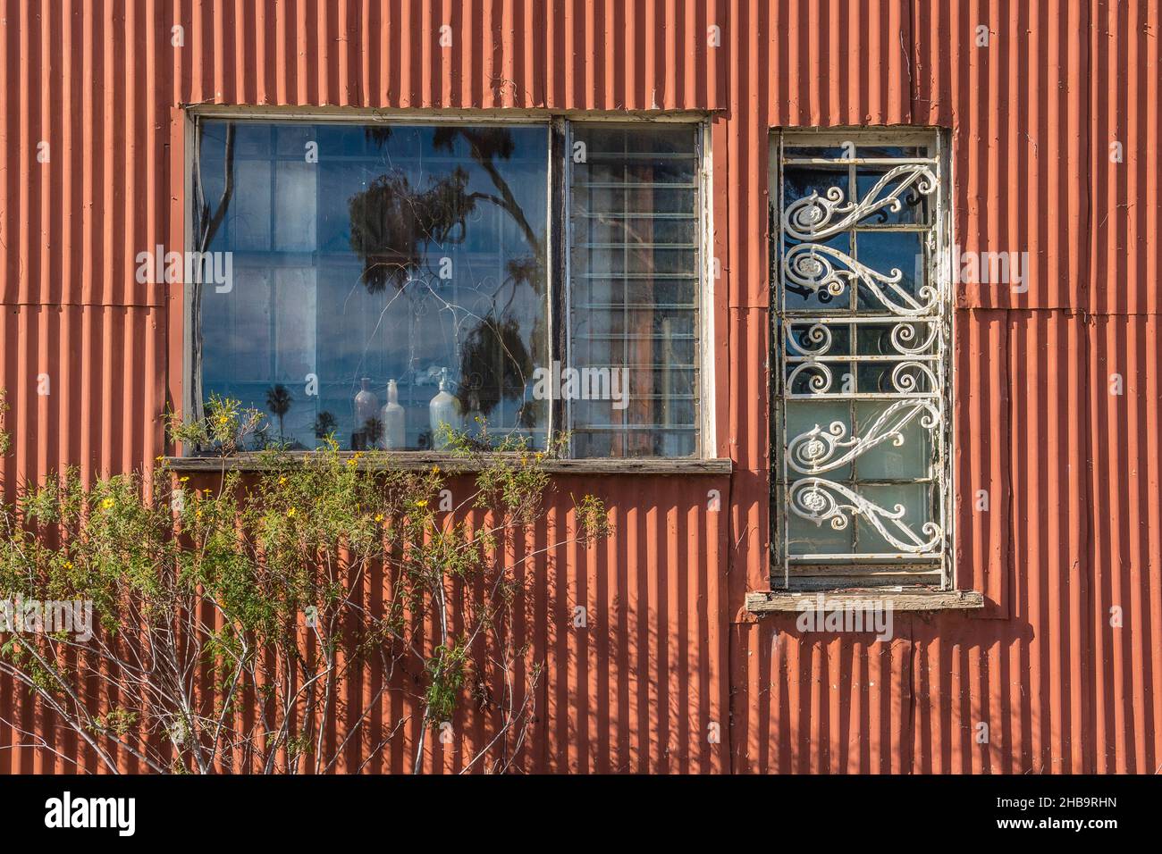 Three different windows in a corrugated sided building Stock Photo - Alamy