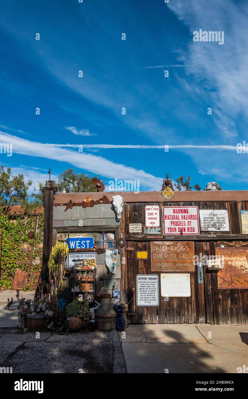 A collection of road signs attached to an old building Stock Photo - Alamy