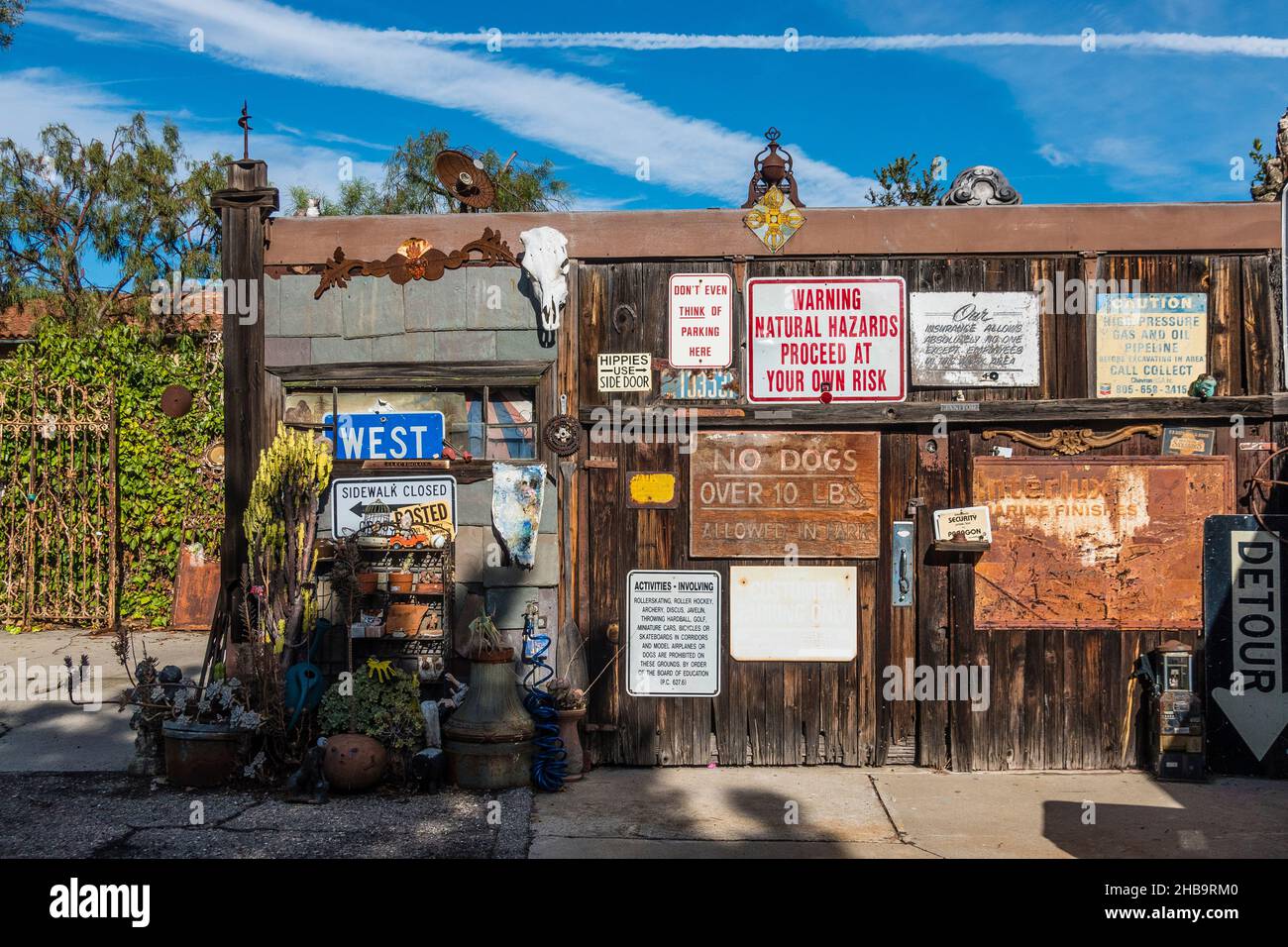 A collection of road signs attached to an old building Stock Photo - Alamy
