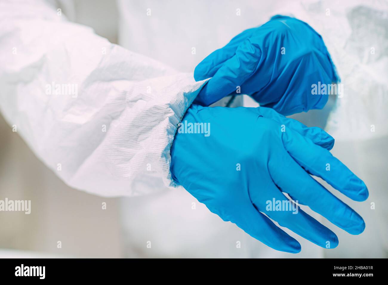 Lab technician gloves protective clothing hi-res stock photography and ...