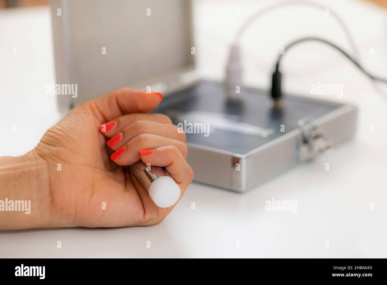 Quantum medicine, conceptual image. Hand holding a quantum analysis ...