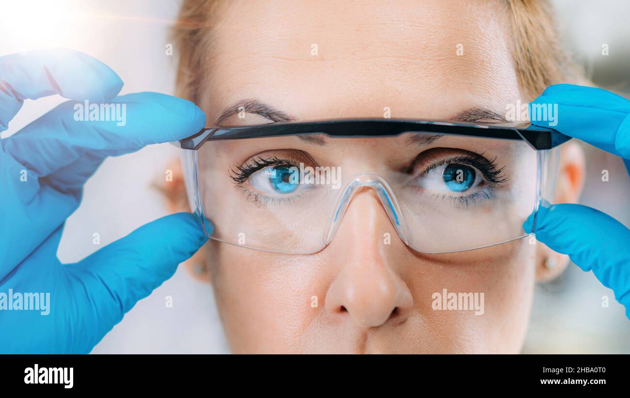 Scientist putting on safety glasses hi-res stock photography and images ...