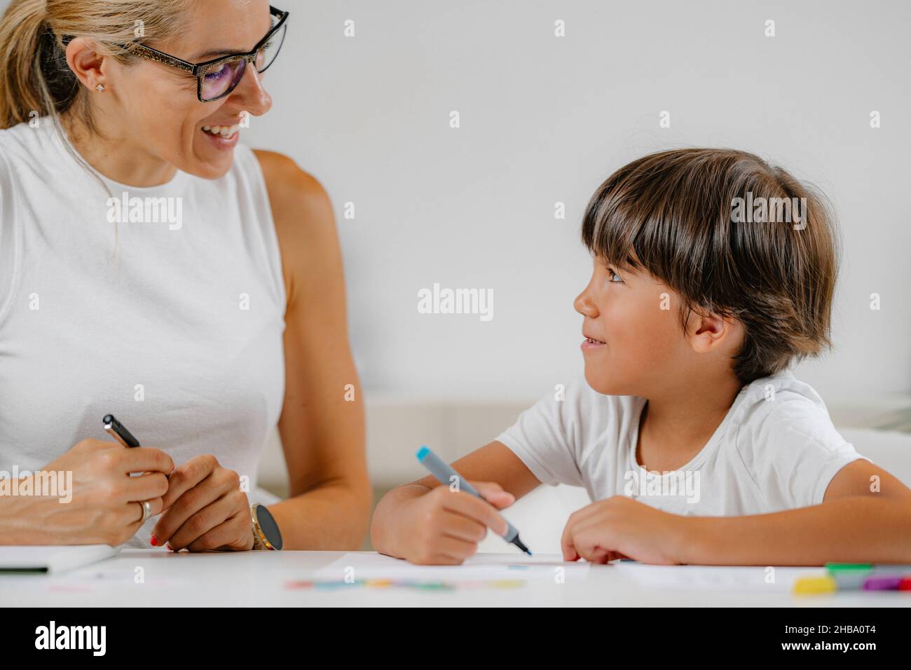 Child colouring shapes in a preschool assessment Stock Photo - Alamy