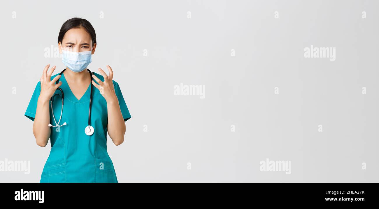 Covid-19, coronavirus disease, healthcare workers concept. Angry and ...