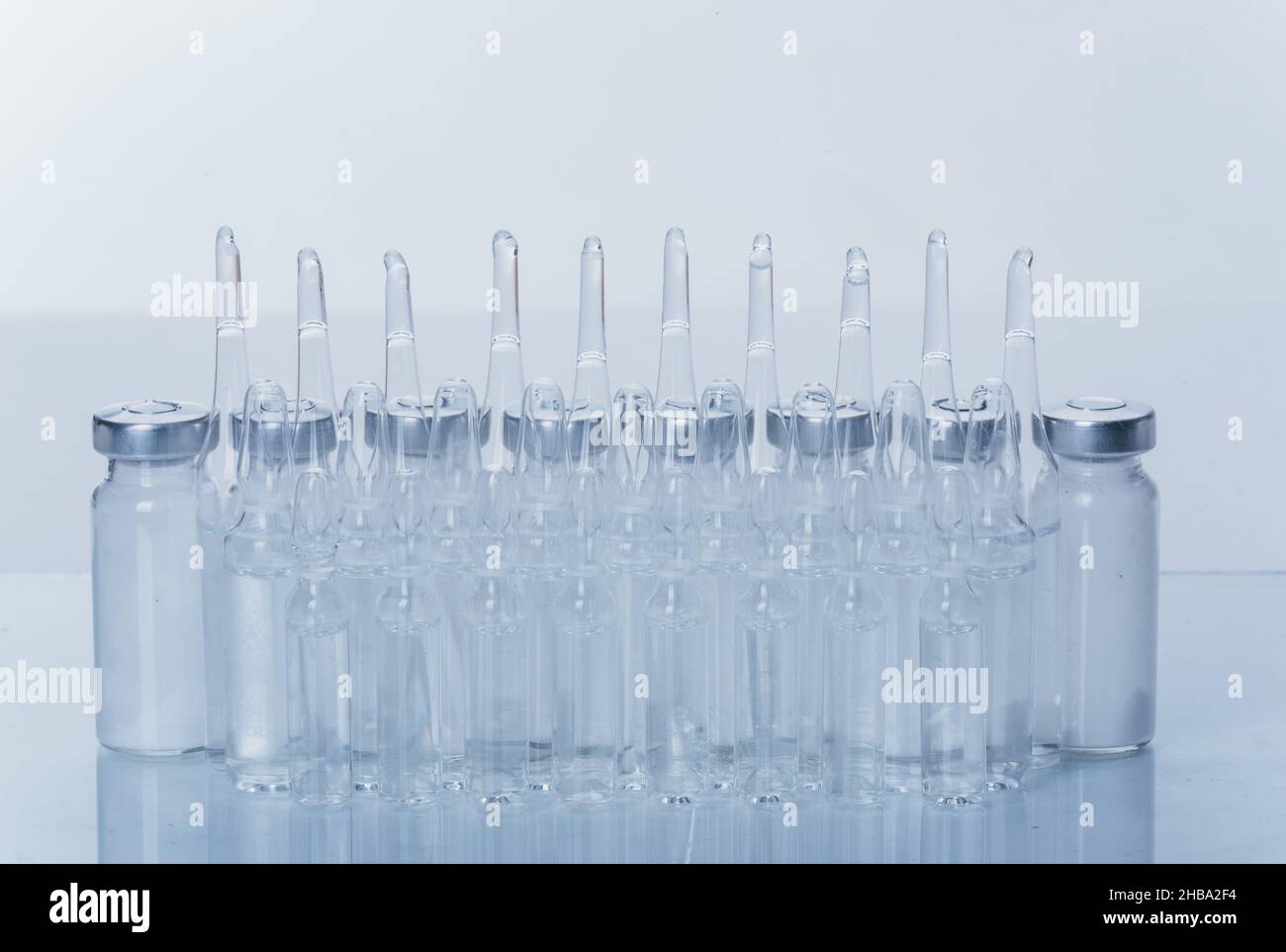 Glass medical ampoule vial for injection. Medicine is dry white drug ...