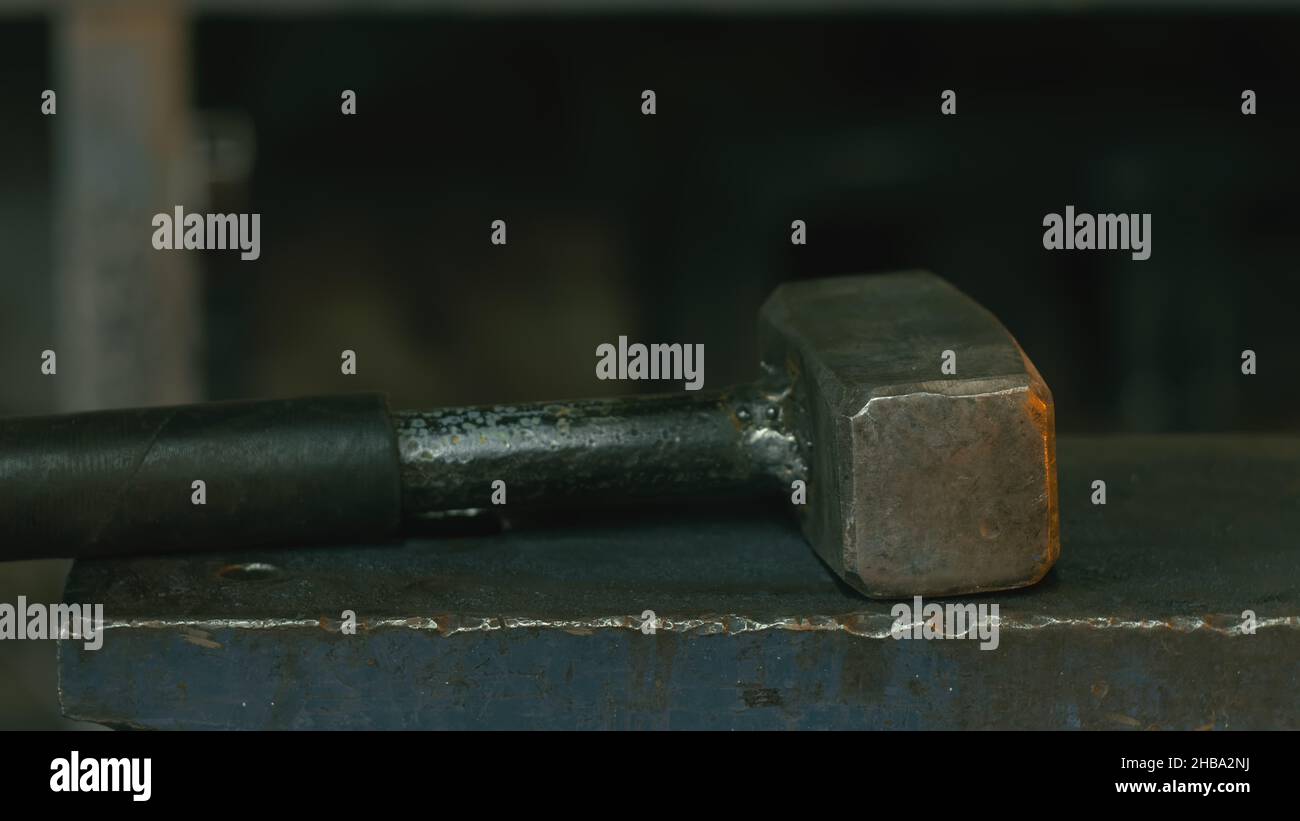 Forge workshop. Smithy manual production. Hands of smith with hammer ...