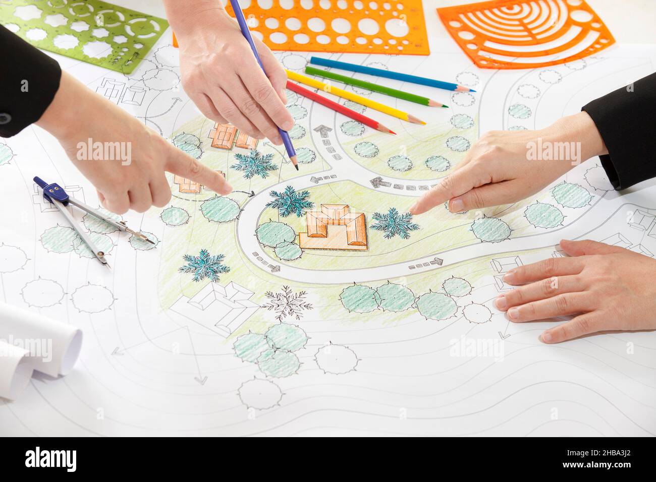 Landscape architect changing drawing at meeting with client Stock Photo ...