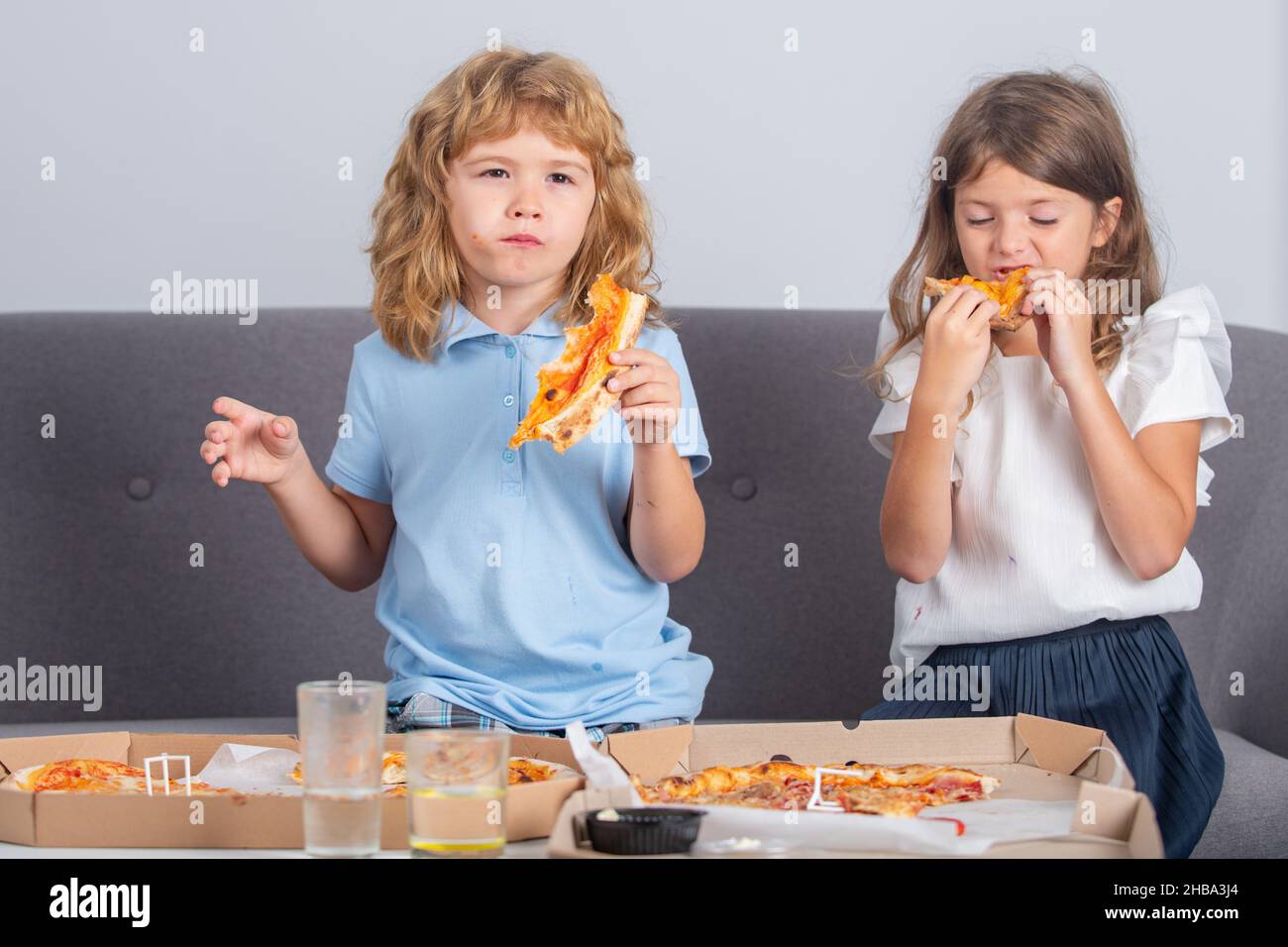 Pizza and kids, slices pizza in kids hand. Children girl and boy eating ...