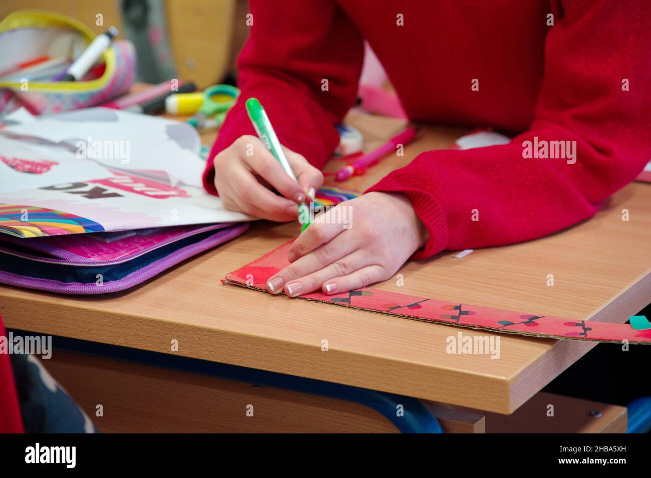 Midsection of student in classroom drawing Stock Photo - Alamy