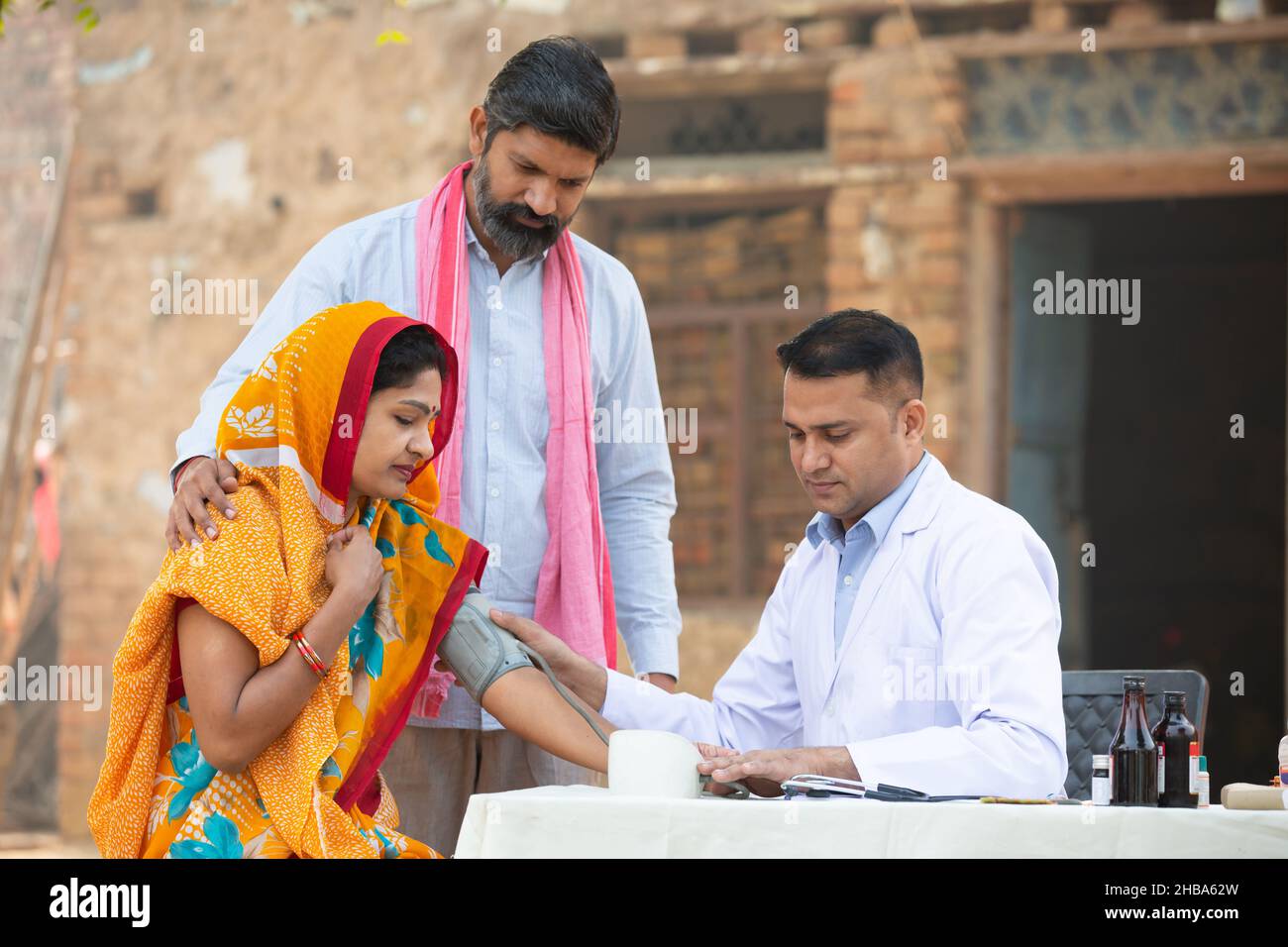 Indian Doctor explaining medical test or prescribing medicine to the ...