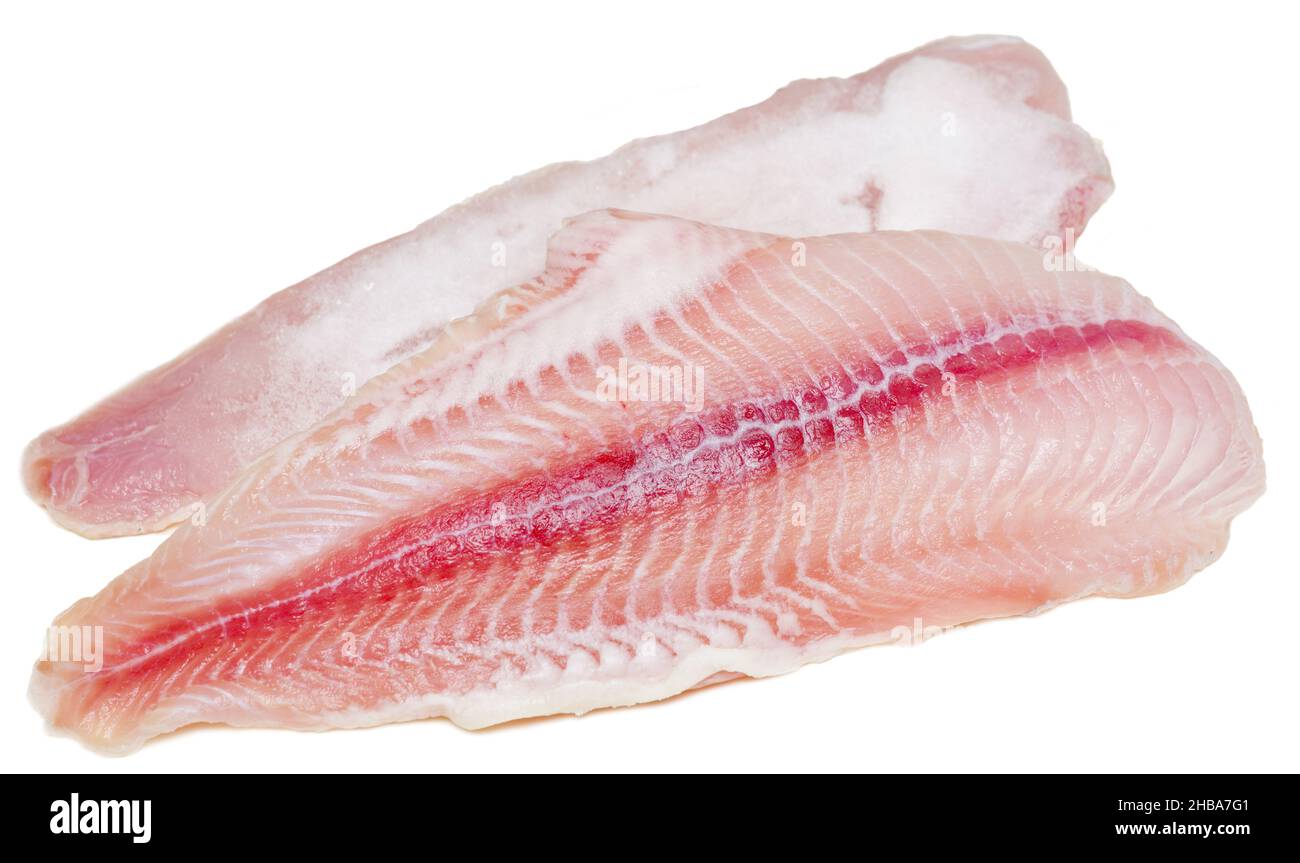 Frozen fish isolated on white background Stock Photo - Alamy