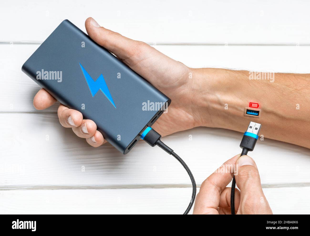Man is charging from the power bank. The concept of a discharged ...