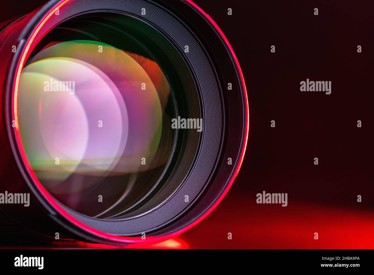 The camera lens and the beautiful light red color. Close-up of the ...