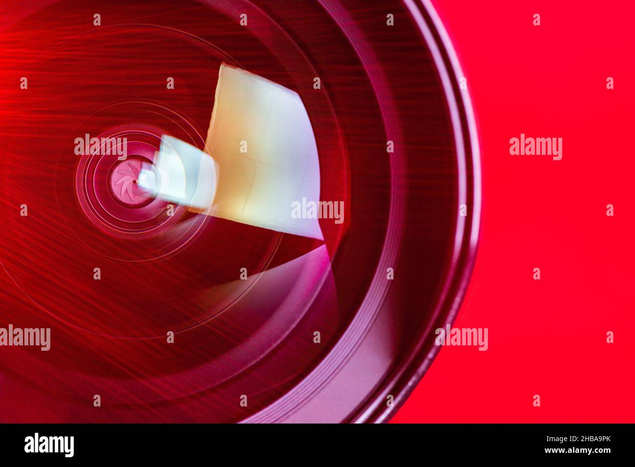 The camera lens and the beautiful light red color. The red rays of ...