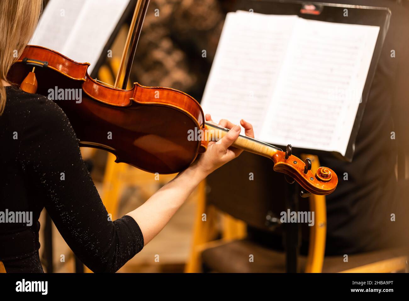 Hand on the strings of a violin Stock Photo - Alamy