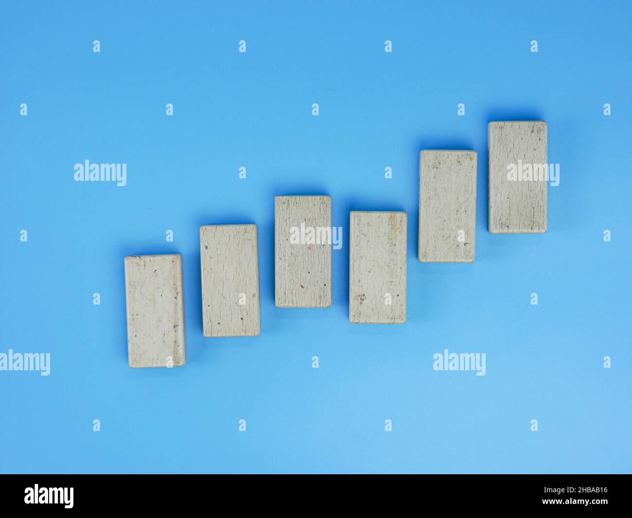 business up and down chart concept, wooden block isolated on blue ...