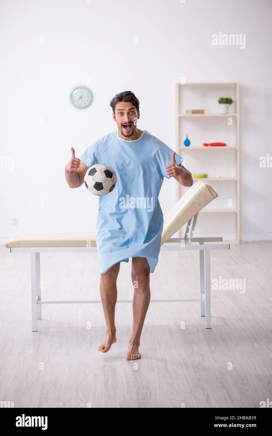 Young male patient playing football at the hospital Stock Photo - Alamy