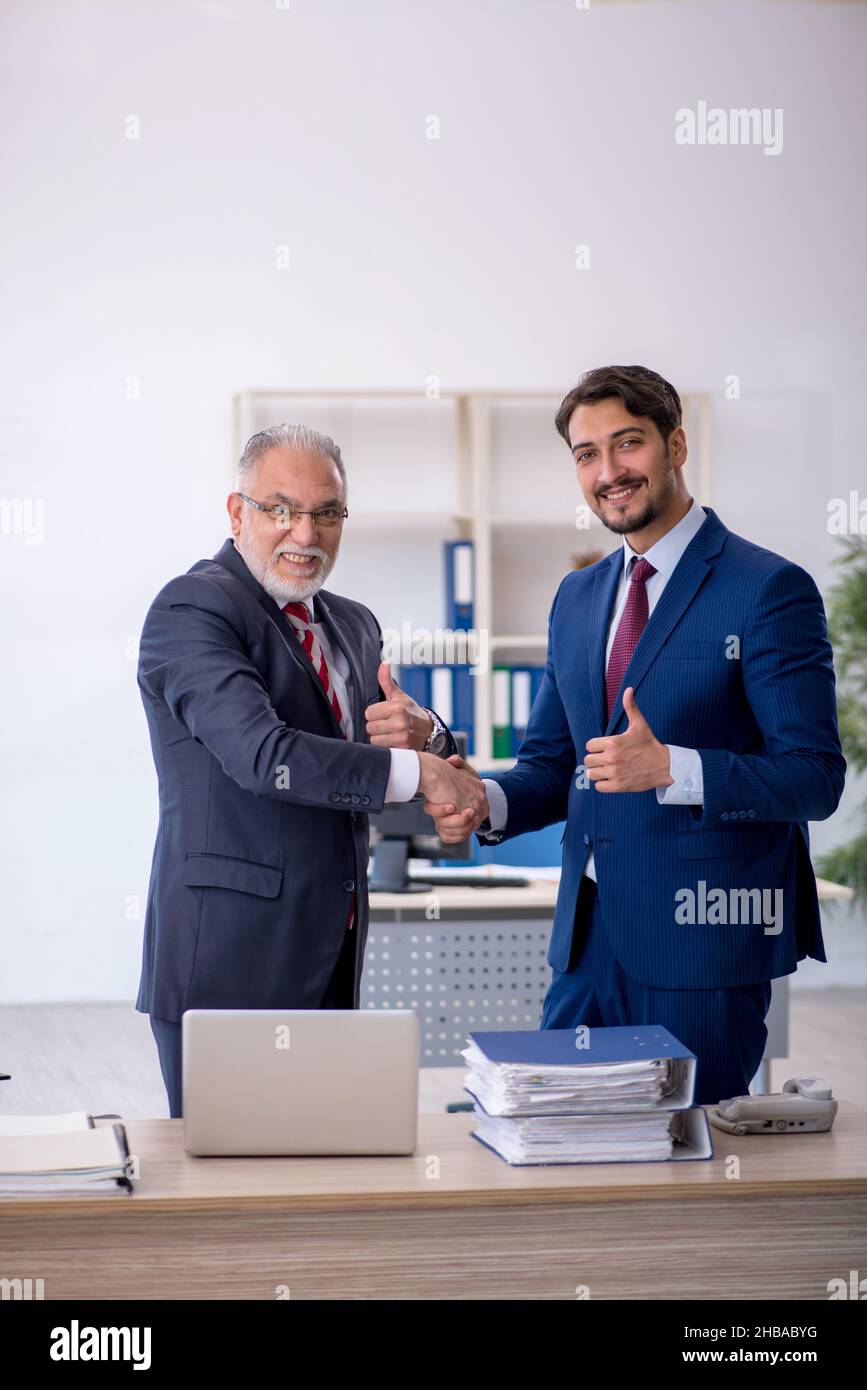 Two colleagues working in the office Stock Photo - Alamy