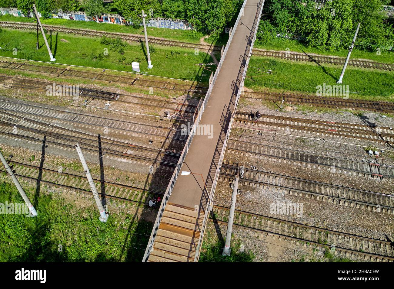Pedestrian bridge over the railway tracks, view from above Stock Photo ...