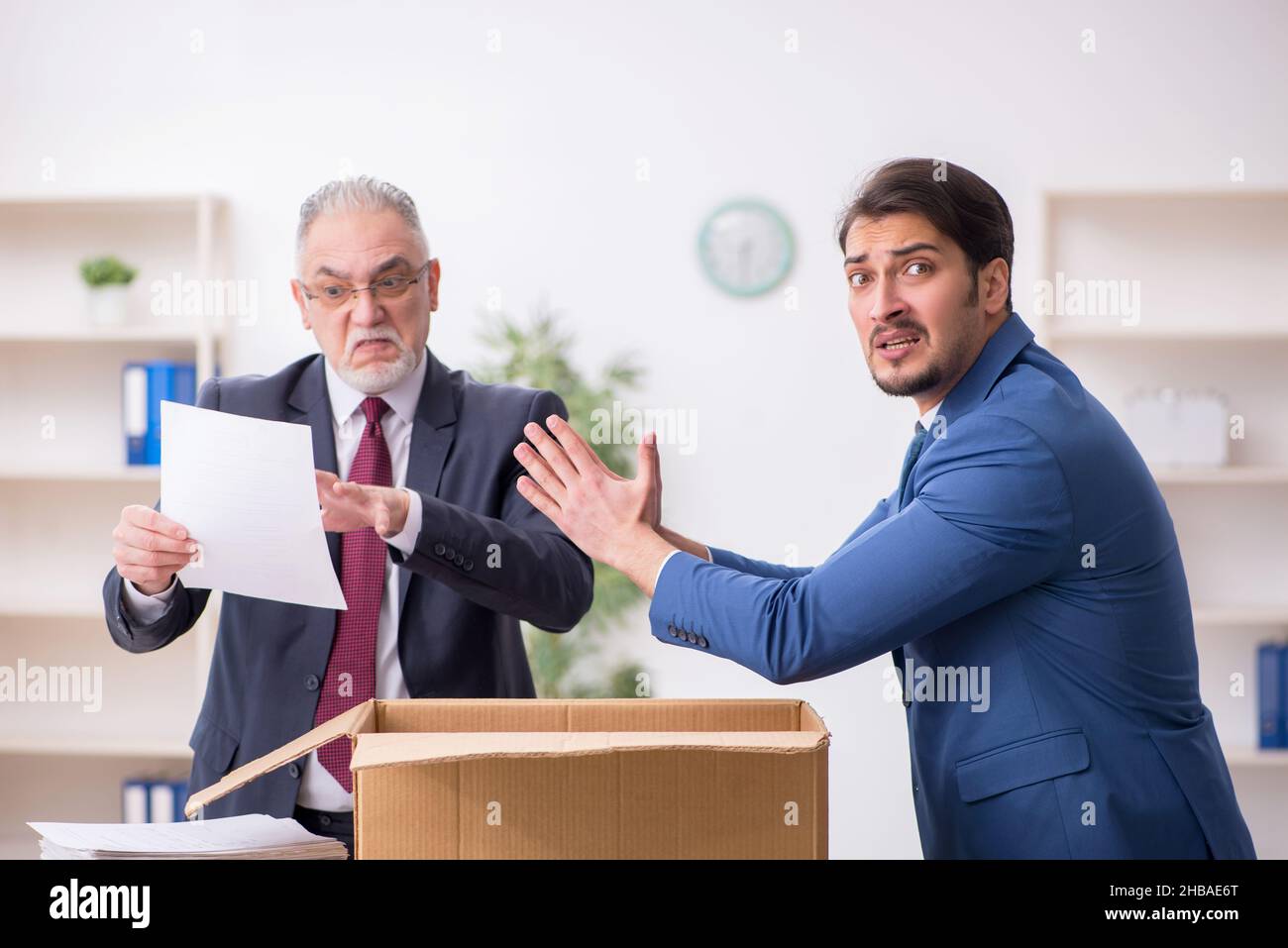 Two employees in dismissal concept Stock Photo - Alamy