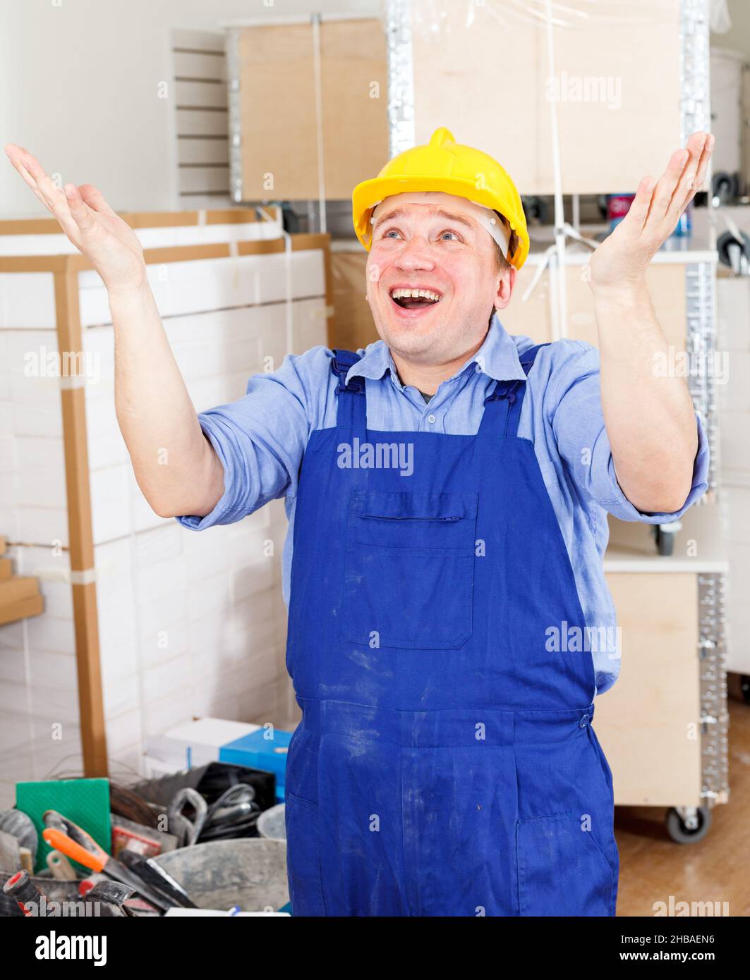 Confused male contractor Stock Photo - Alamy