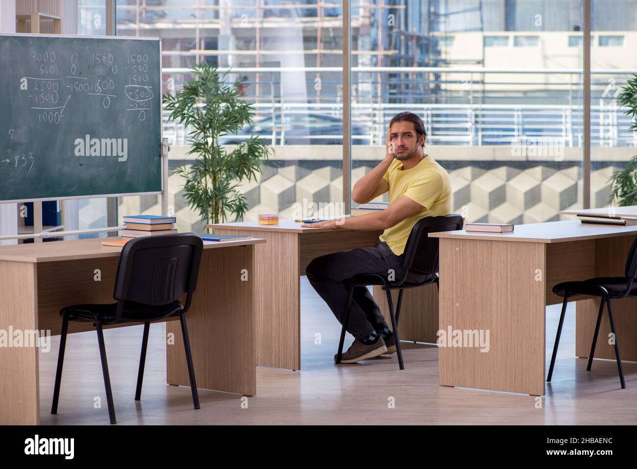 Male student sitting in the classroom Stock Photo - Alamy