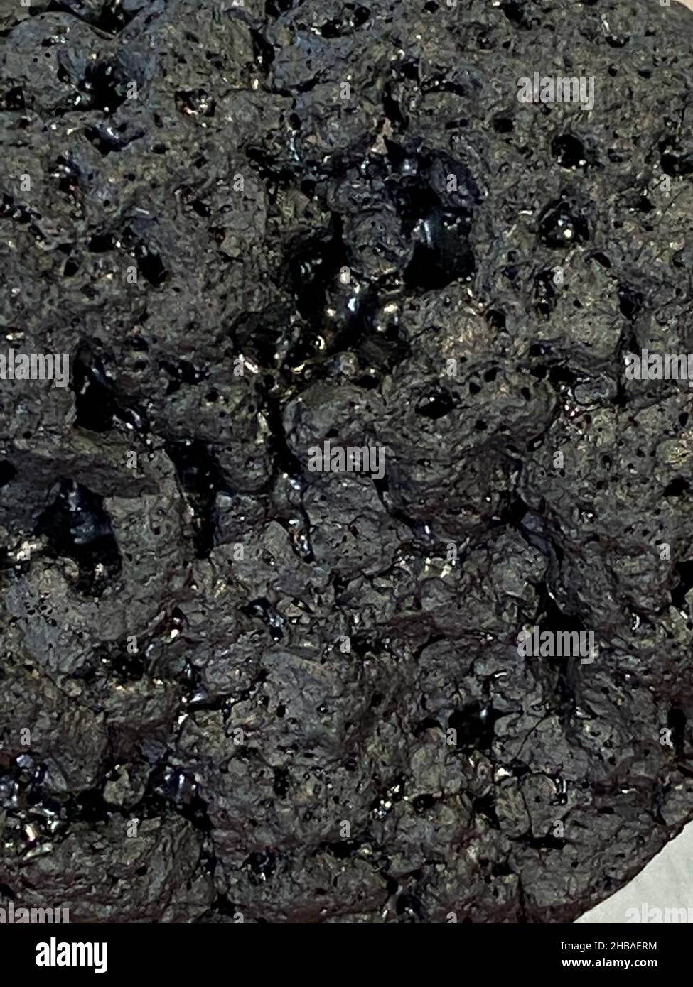 surface of lava rock with metal silver platinum deposits in Stock Photo ...