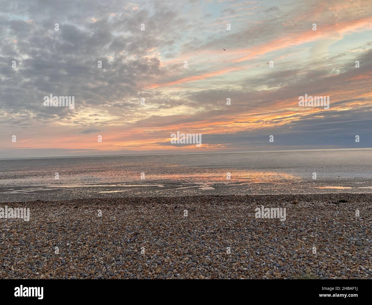 Coral pacific pink sunset over Dungeness Greatstone beach sunset Kent ...