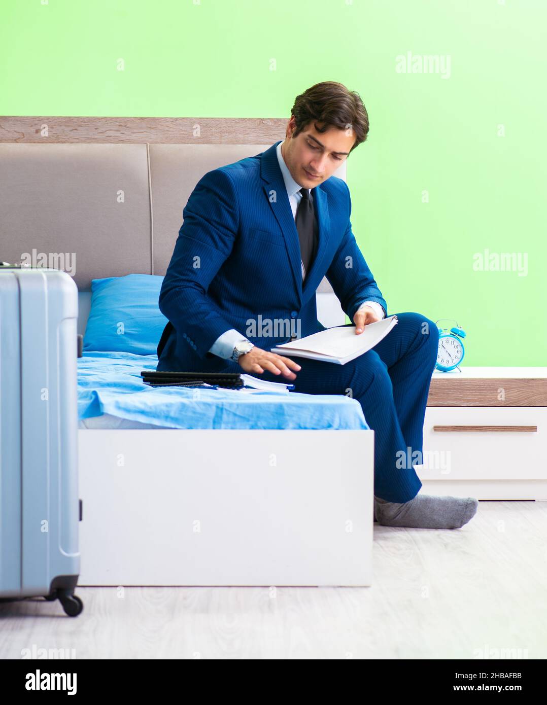 The businessman working in the hotel room Stock Photo - Alamy