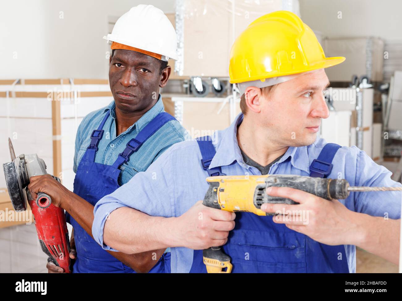 Builders using manual power tools Stock Photo - Alamy