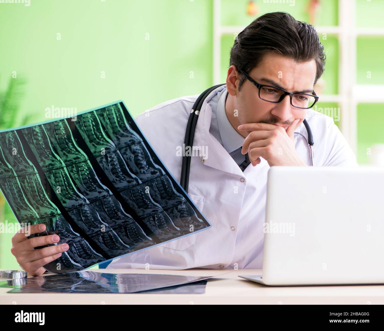 The doctor radiologist looking at x-ray scan in hospital Stock Photo ...