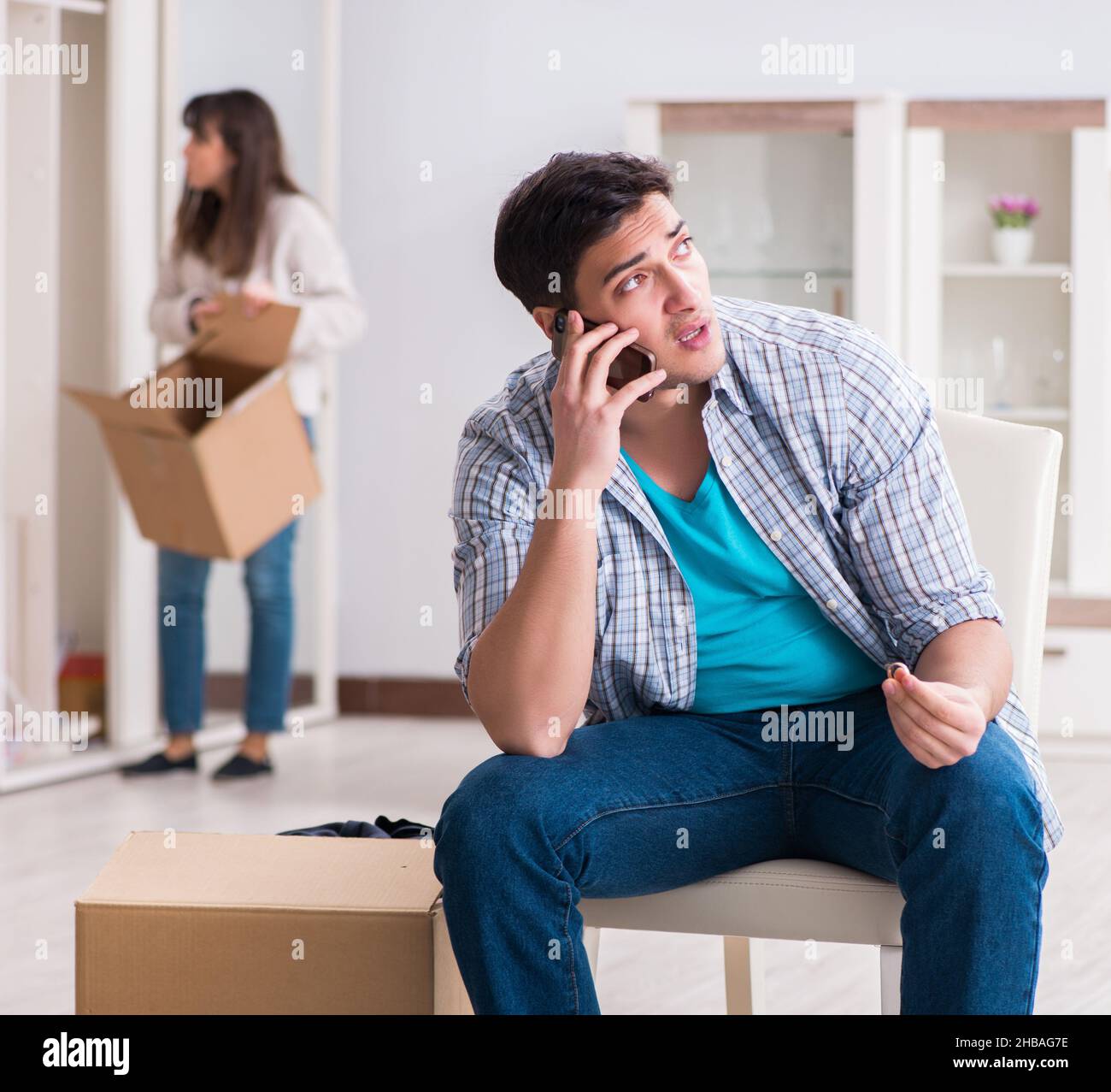 The woman evicting man from house during family conflict Stock Photo ...