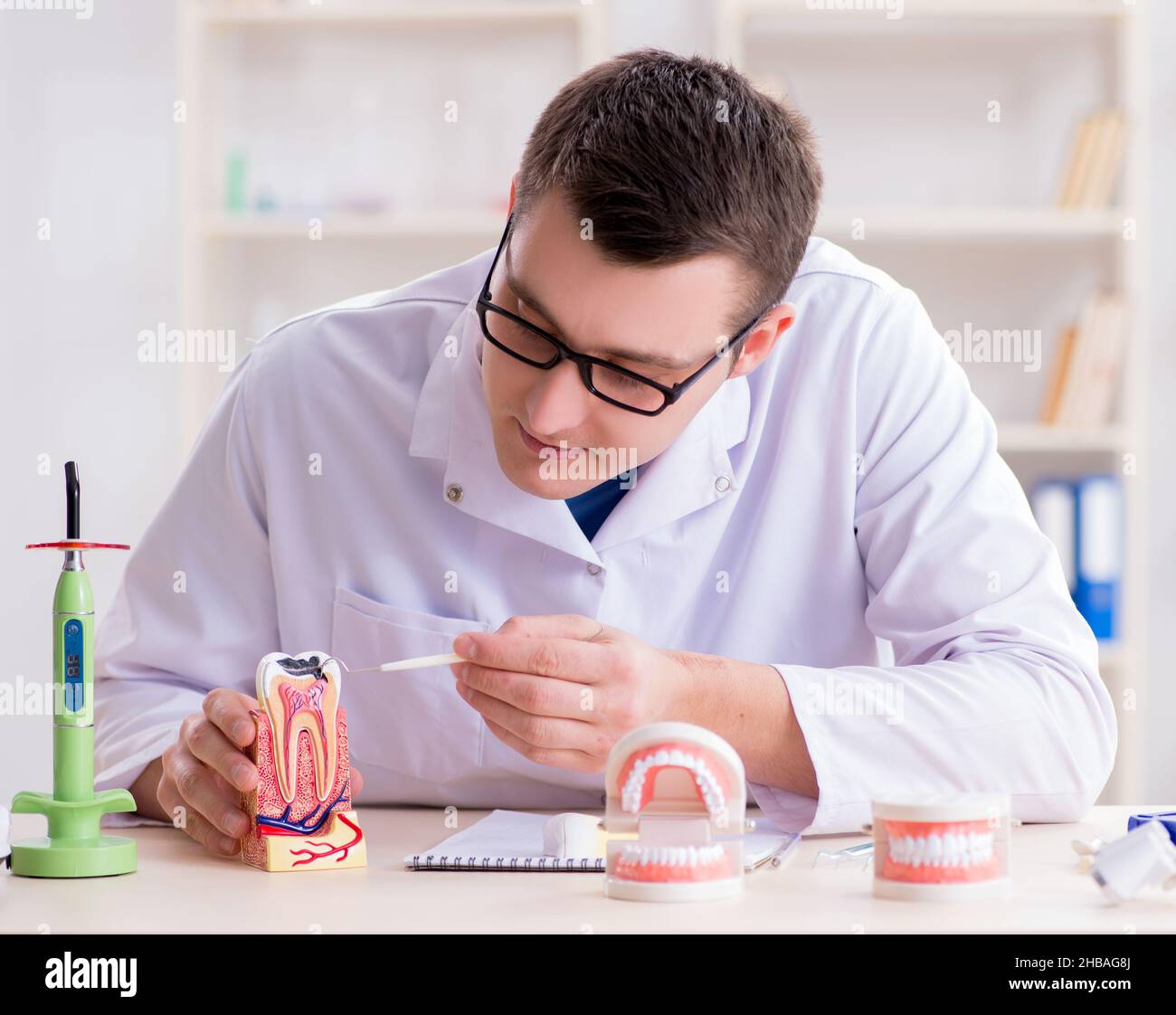 The dentist working teeth implant in medical lab Stock Photo - Alamy