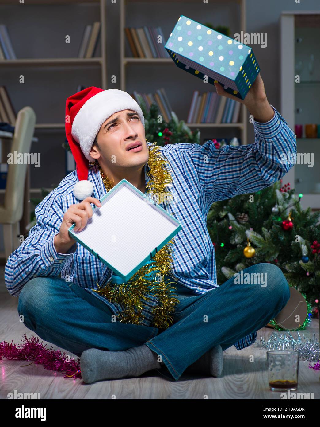 The man celebrating christmas at home alone Stock Photo - Alamy