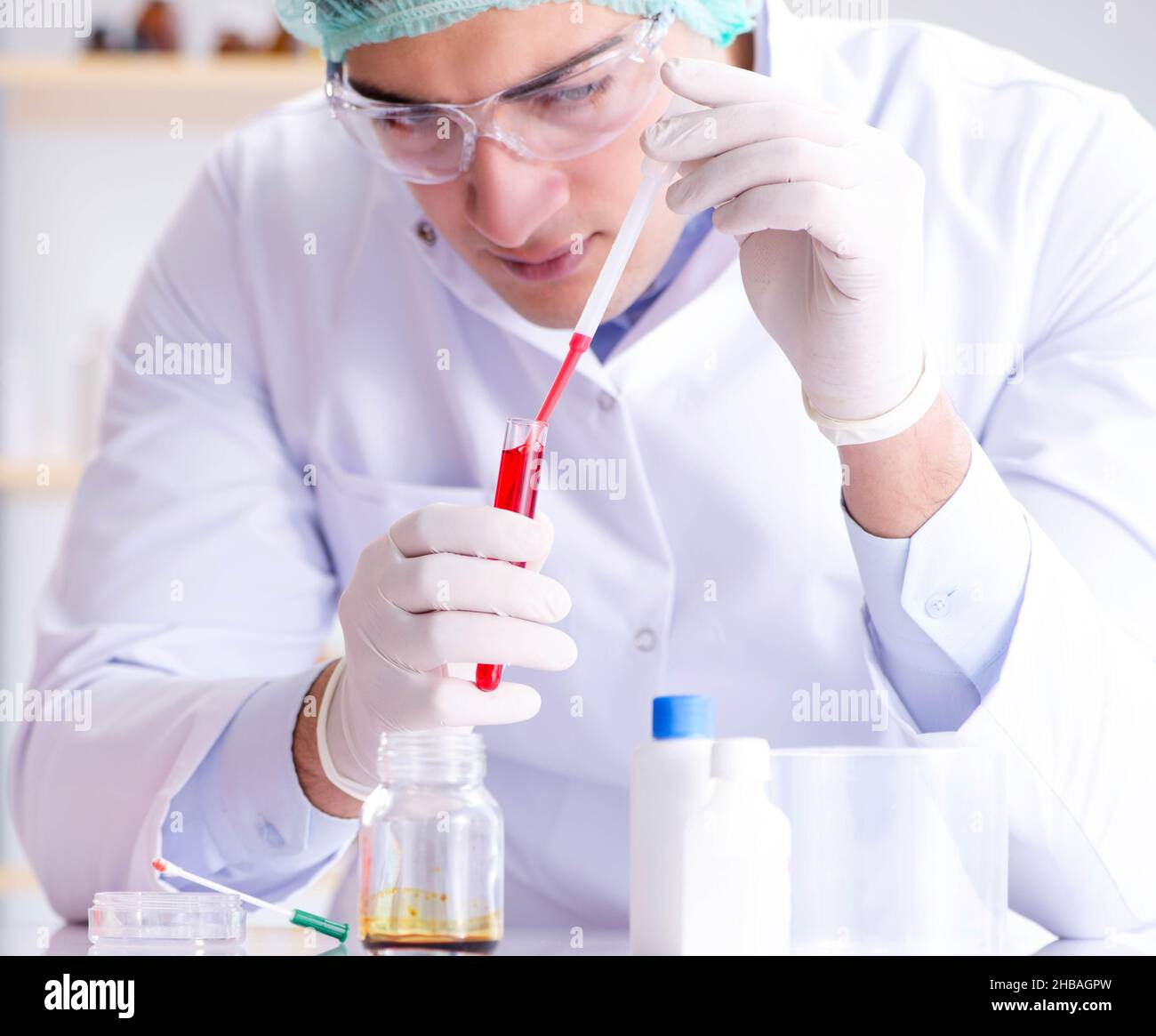 The blood testing in the lab with young scientist Stock Photo - Alamy