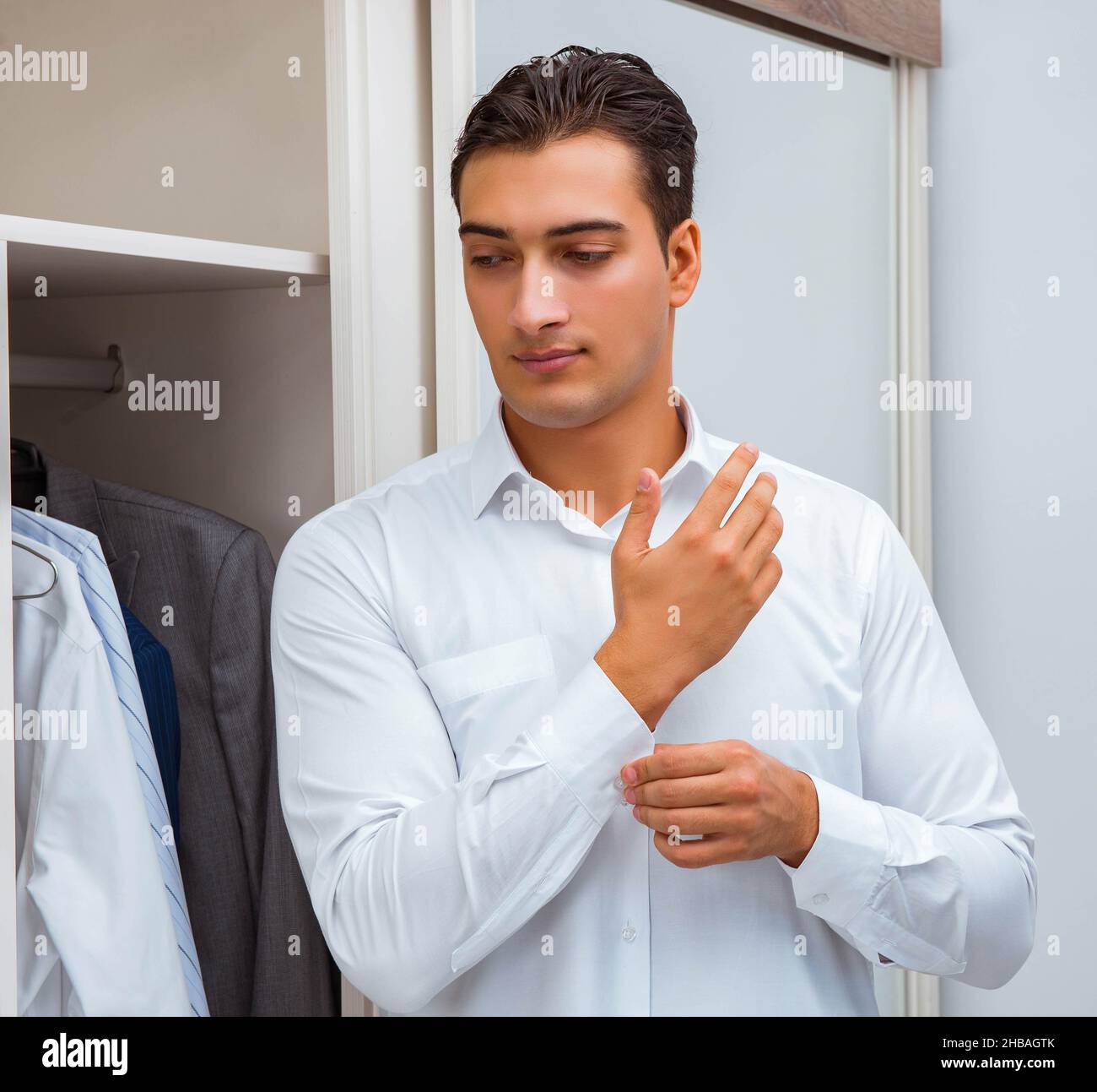 The businessman dressing up for work Stock Photo - Alamy