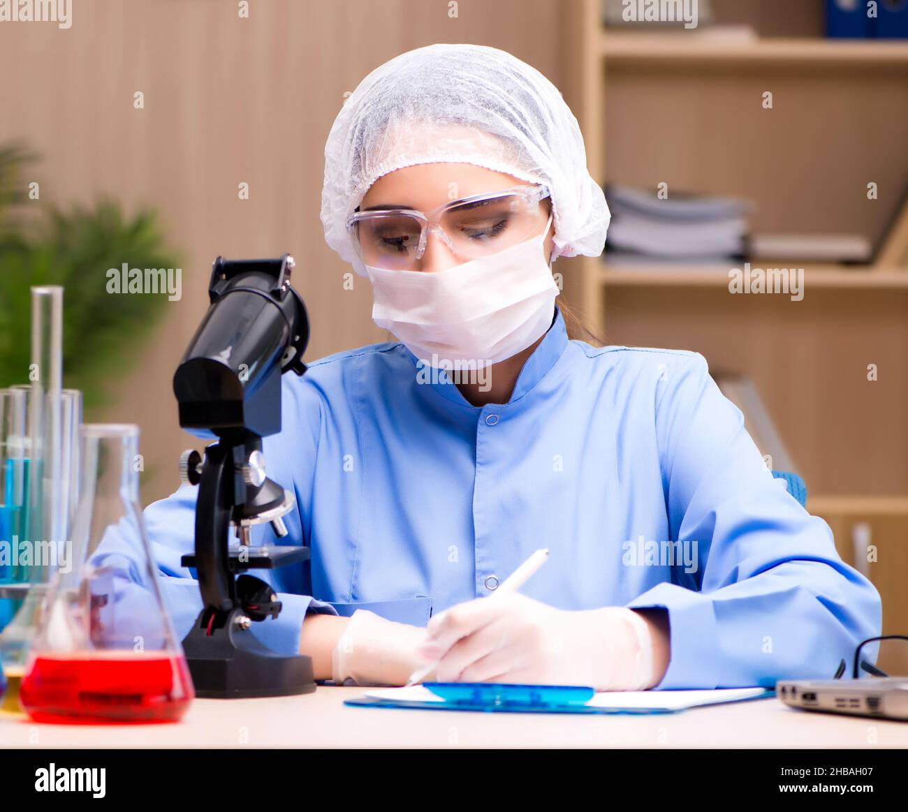 The lab chemist working with microscope and tubes Stock Photo - Alamy