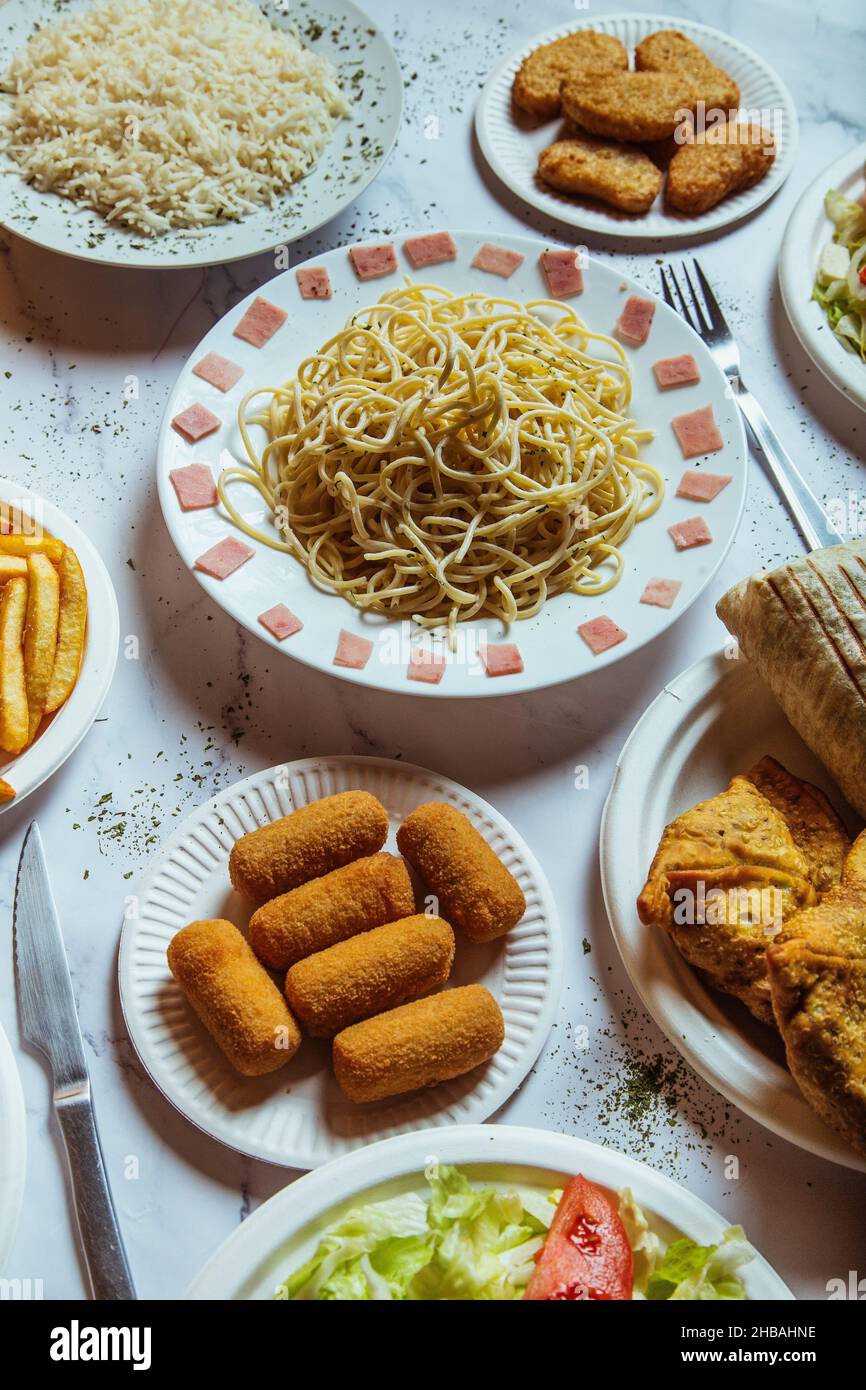Vertical view of variety of dishes on fast food restaurant table Stock ...