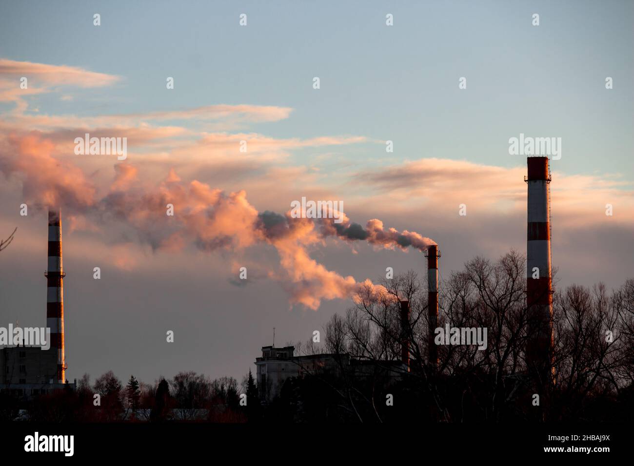 Tall boiler pipes and dense steam in the atmosphere Stock Photo - Alamy