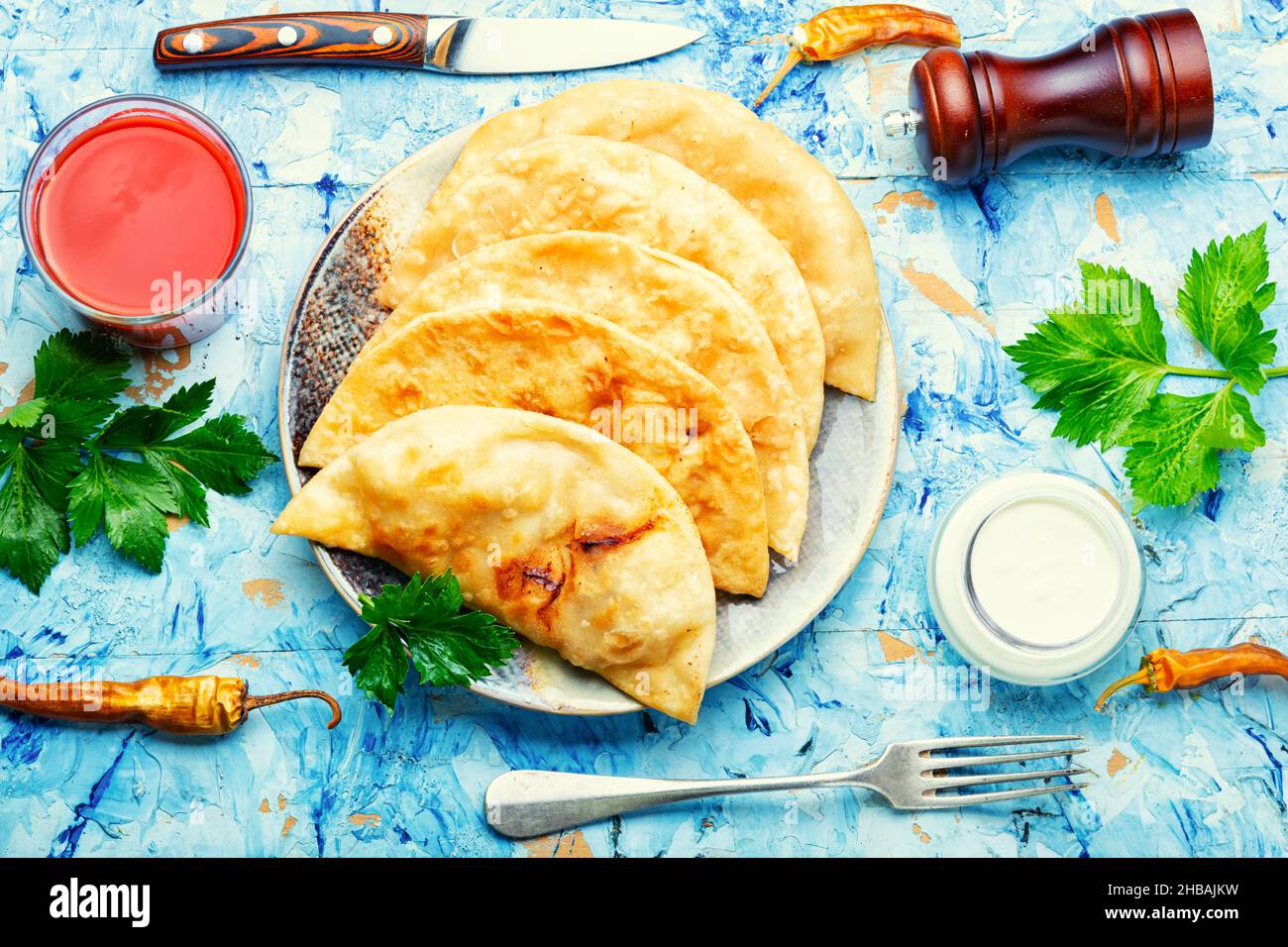 Cheburek, a dish of unleavened dough stuffed with minced meat. Fried ...