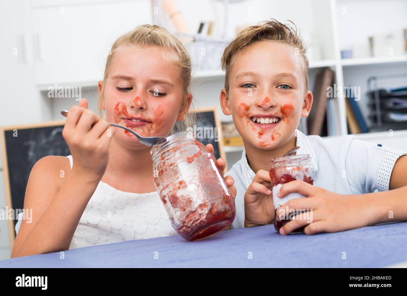 Friends are having lunch time and eating jam Stock Photo - Alamy