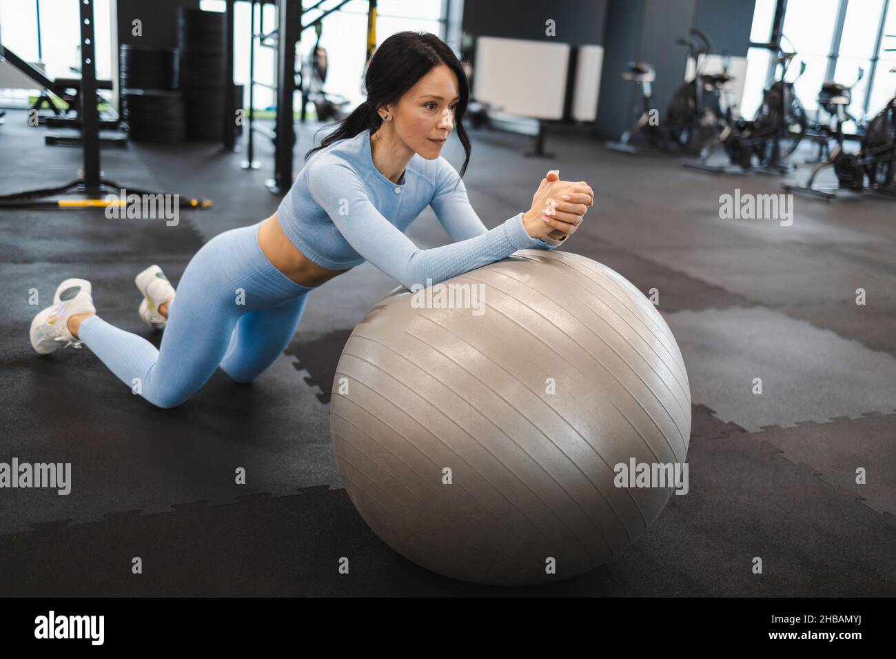 Sports girl exercising with a fitness ball Stock Photo - Alamy
