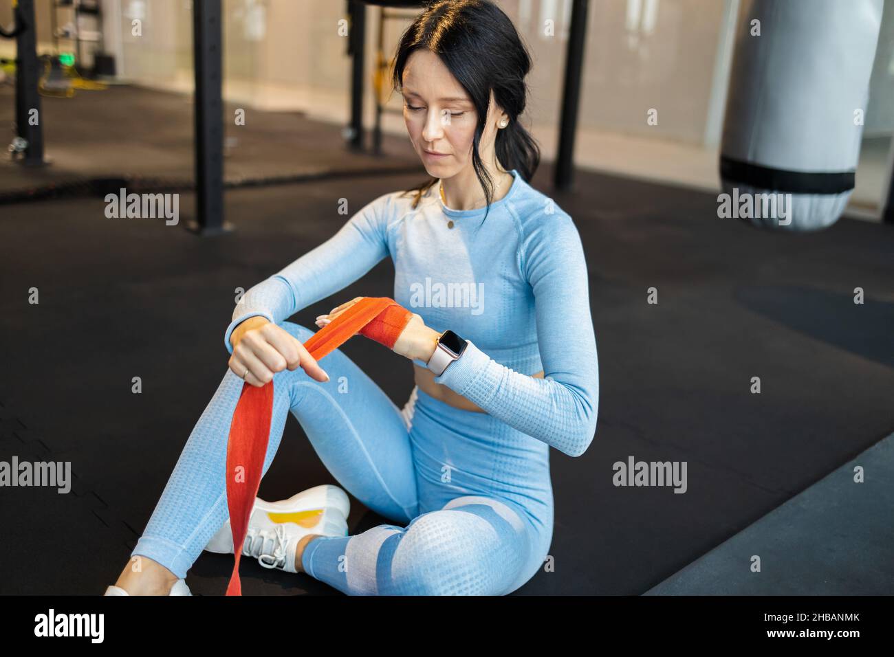 Female athlete wearing strap on wrist Stock Photo - Alamy
