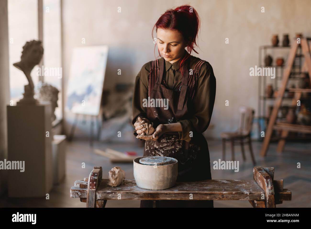 Woman creating clay sculpture hi-res stock photography and images - Alamy