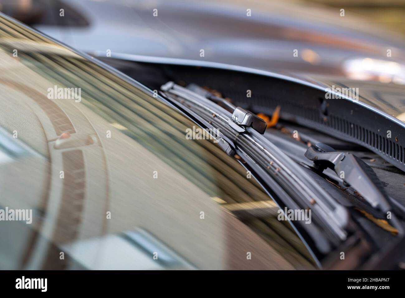 A macro portrait of a windshield wiper of a car standing at its lowest ...