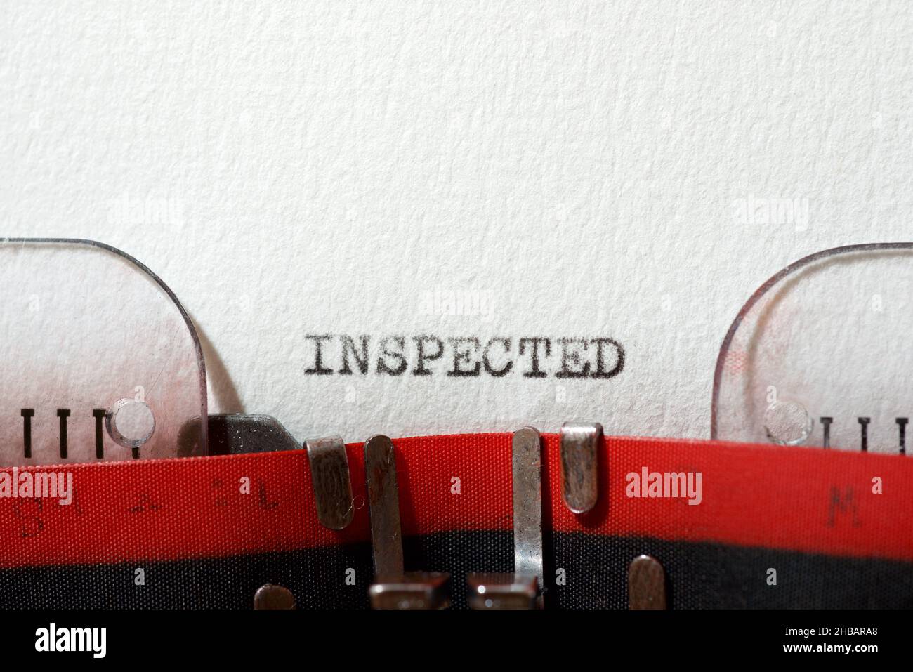 The word inspected written with a typewriter Stock Photo - Alamy