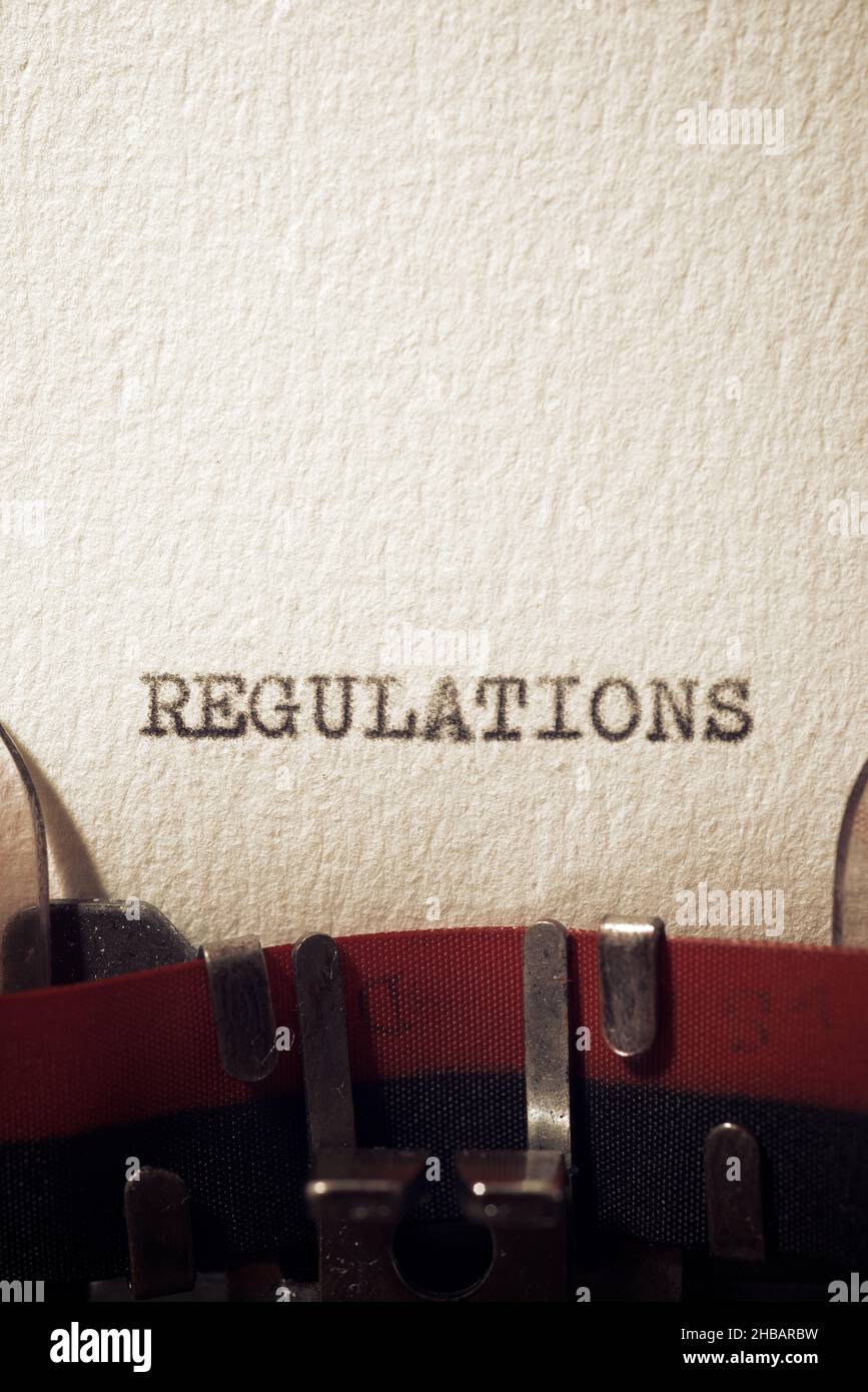 The word regulations written with a typewriter Stock Photo - Alamy