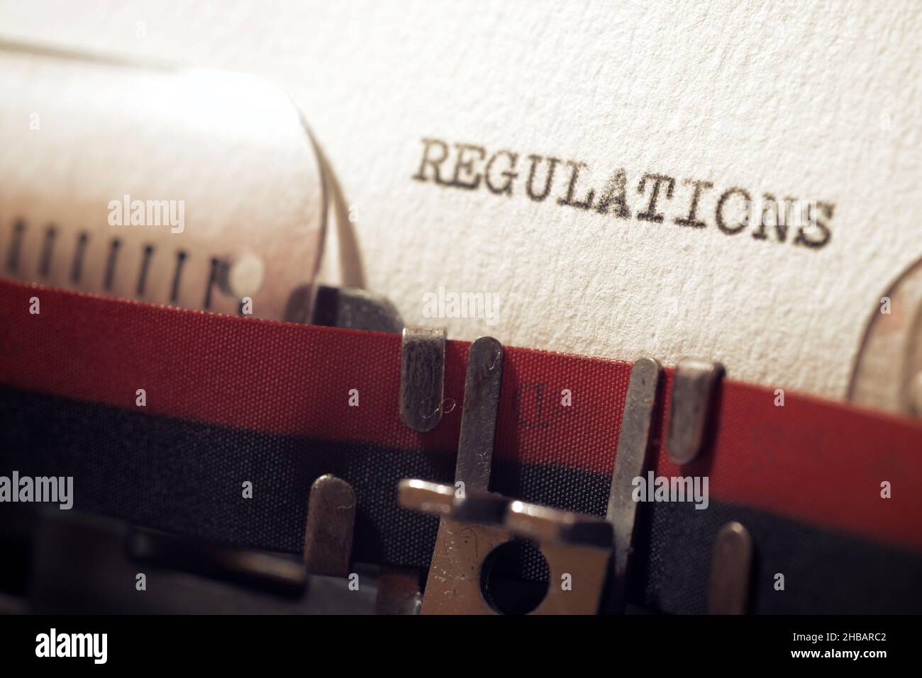 The word regulations written with a typewriter Stock Photo - Alamy