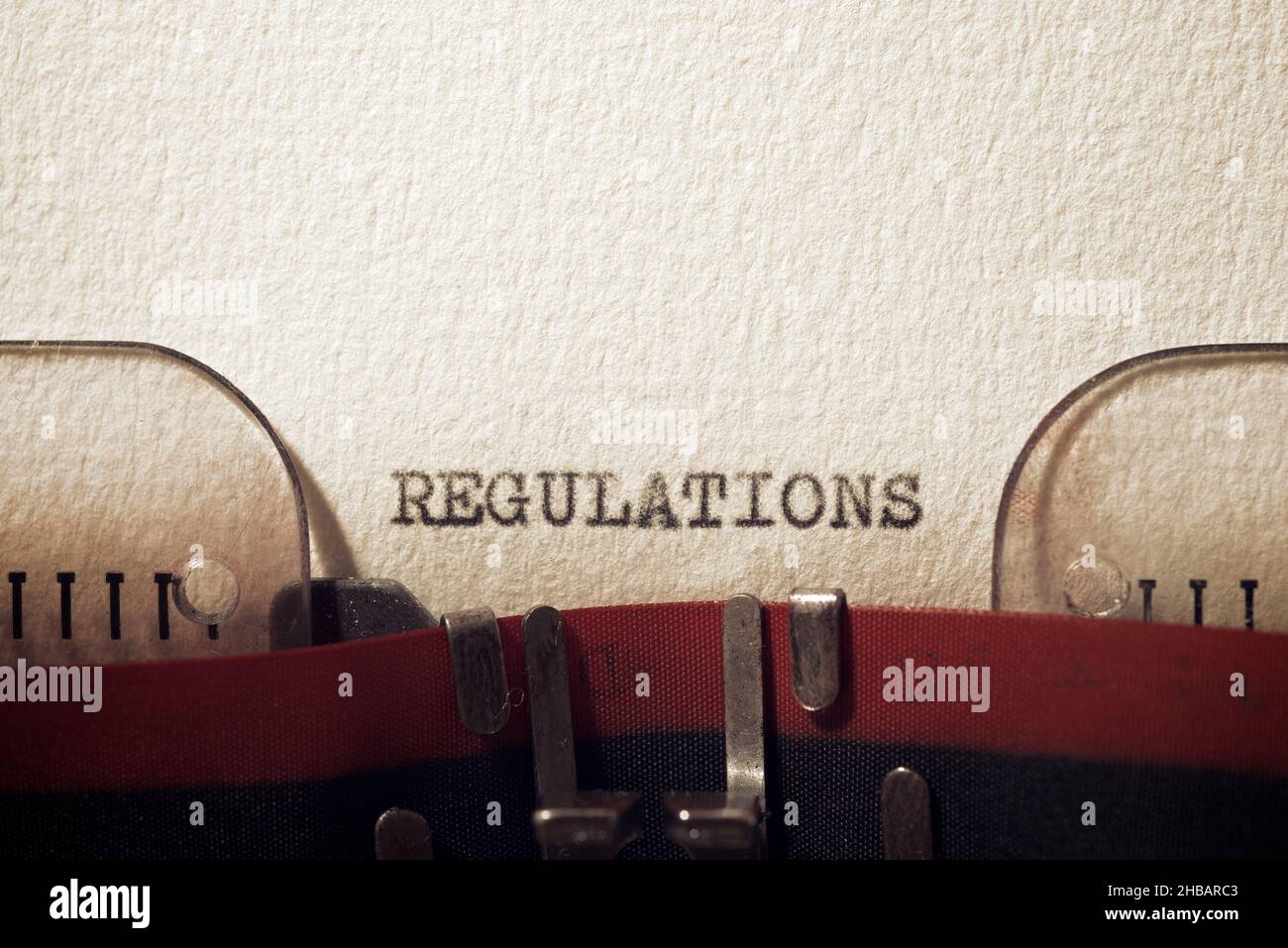 The word regulations written with a typewriter Stock Photo - Alamy